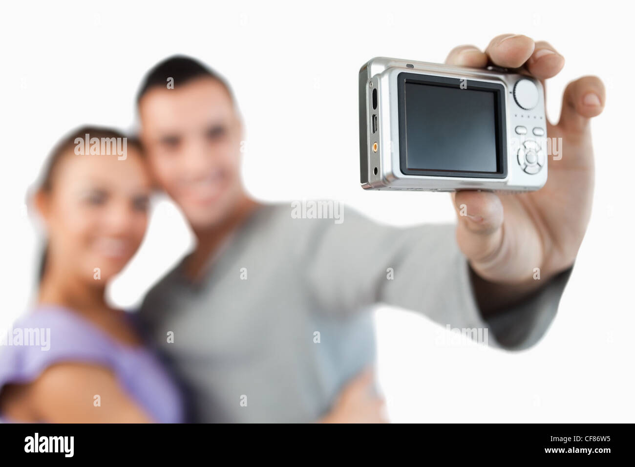 Camera being used to take a picture of young couple Stock Photo - Alamy