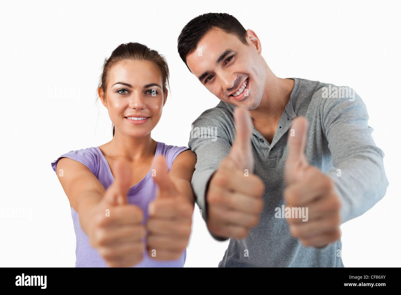 Young couple giving approval Stock Photo - Alamy