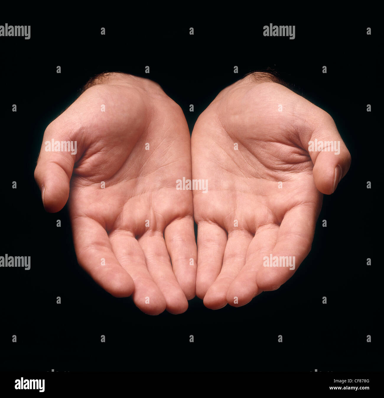 Two human hands in a gesture of offering Stock Photo - Alamy