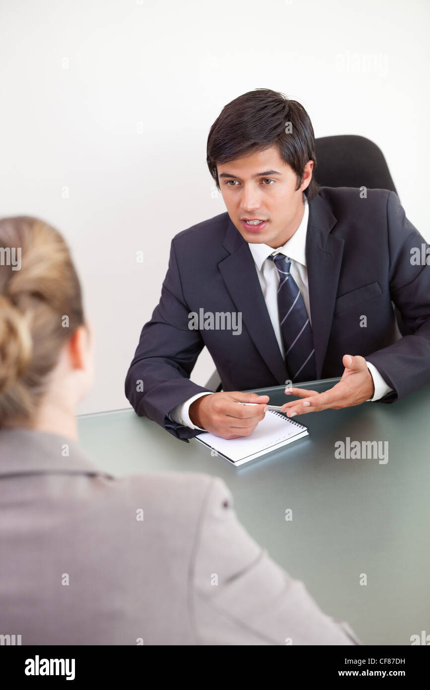 Portrait of a manager interviewing a female applicant Stock Photo - Alamy
