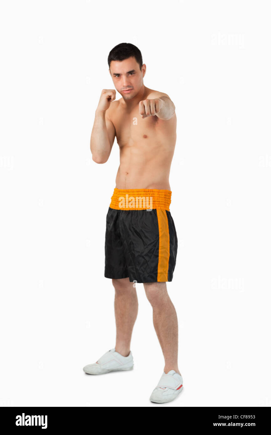 Serious looking boxer striking straight Stock Photo - Alamy