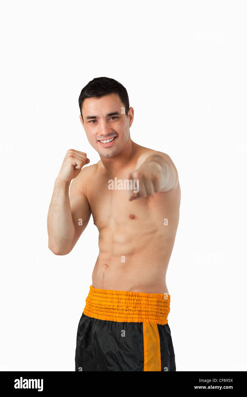 Smiling young martial art fighter Stock Photo - Alamy