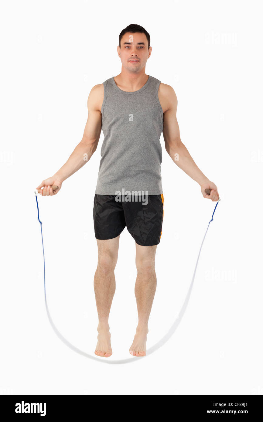 Young sportsman doing jump roping Stock Photo - Alamy