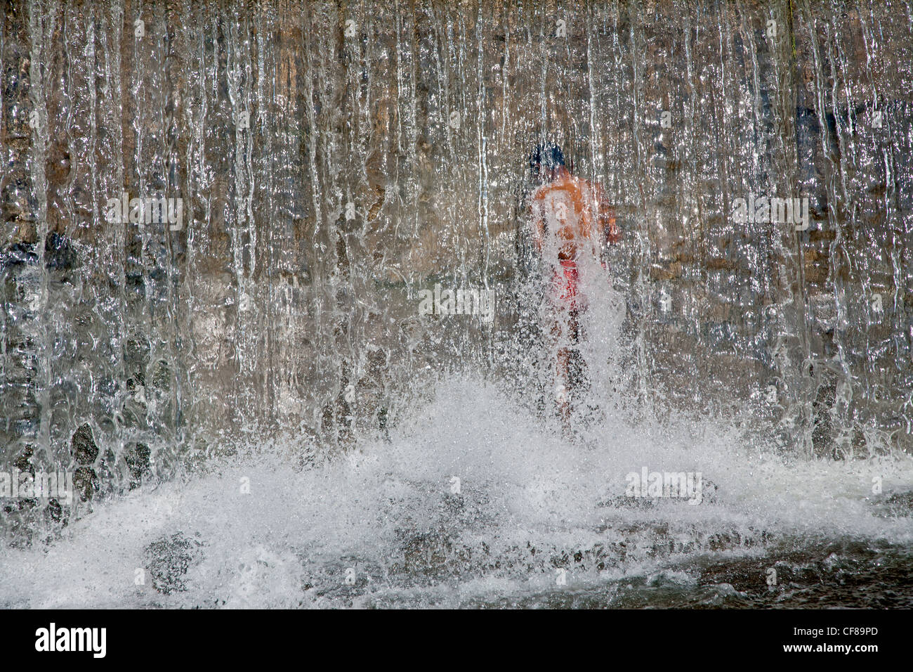 Man under waterfall hi-res stock photography and images - Alamy