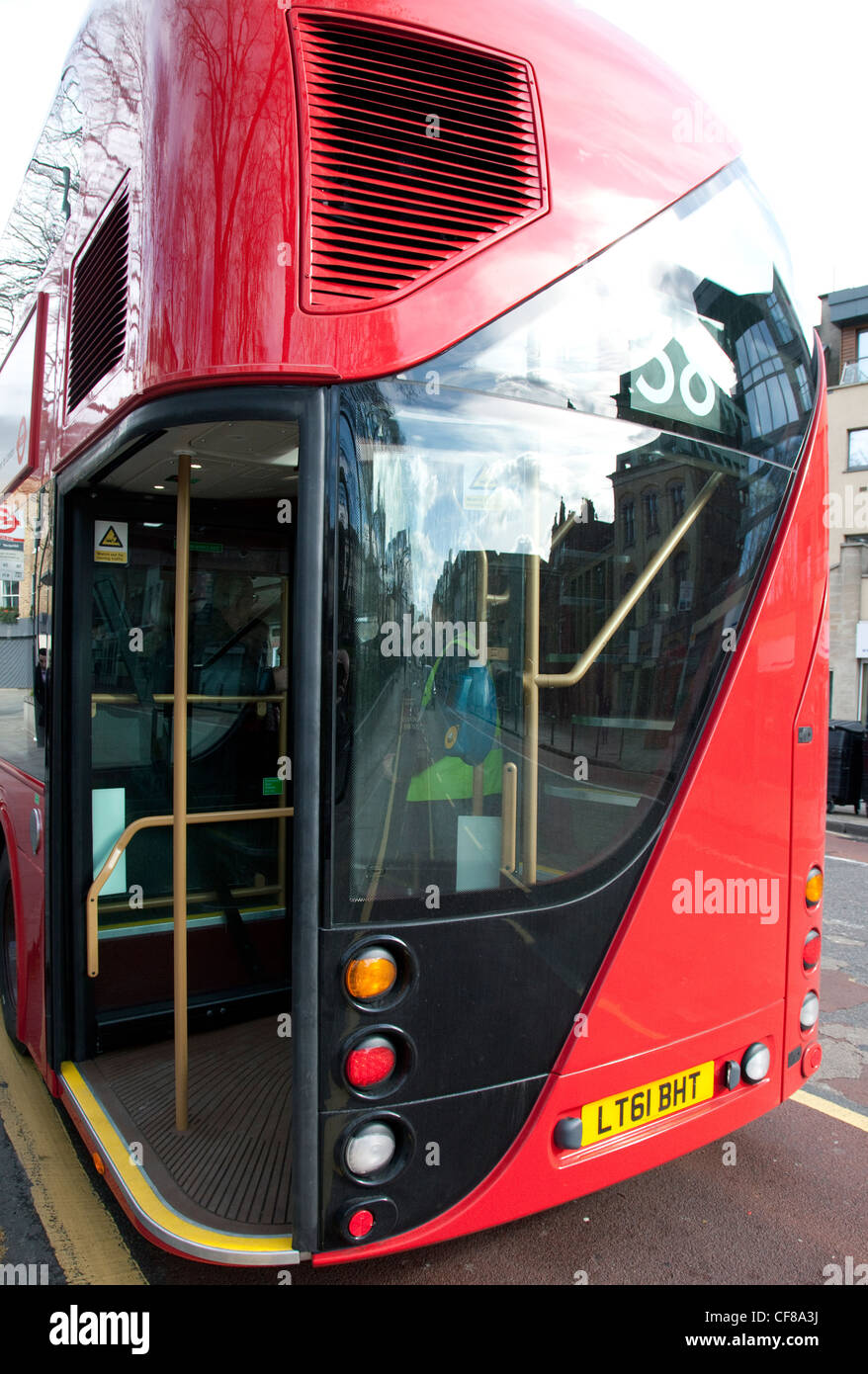 New Routemaster at bus stop, London - open rear platform Stock Photo ...