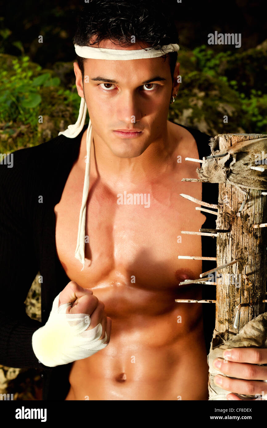 View of a fighter male holding a mace weapon on a forest Stock Photo ...