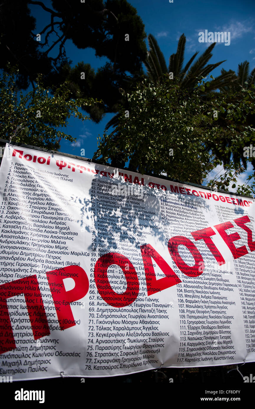 A banner with the name of the Greek MP's who voted the memorandum and ...