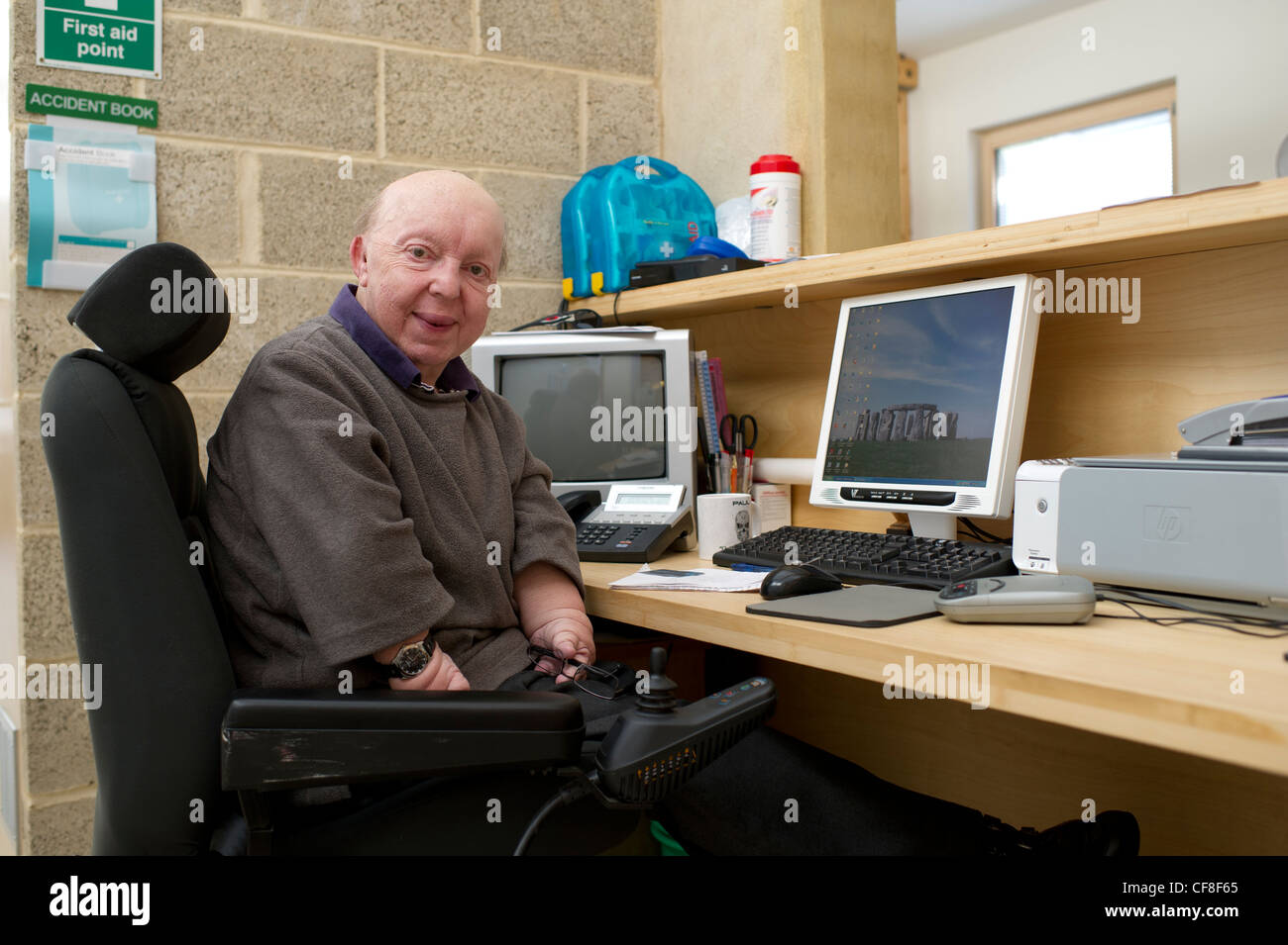 A disabled male with multiple congenital deformities working on the ...