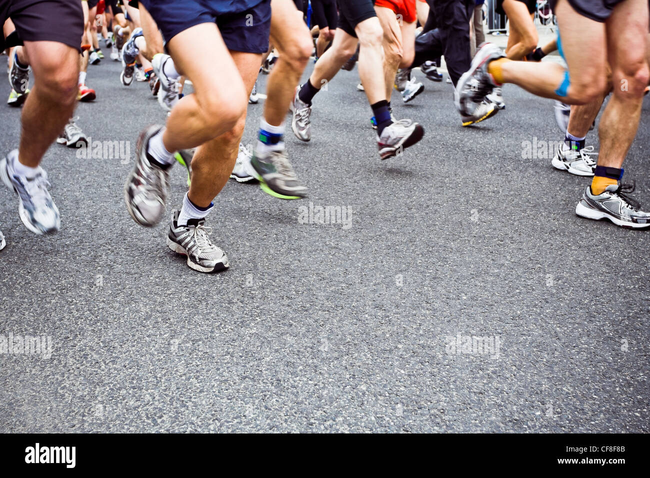 People running in city marathon on streets, sport and fitness on road ...