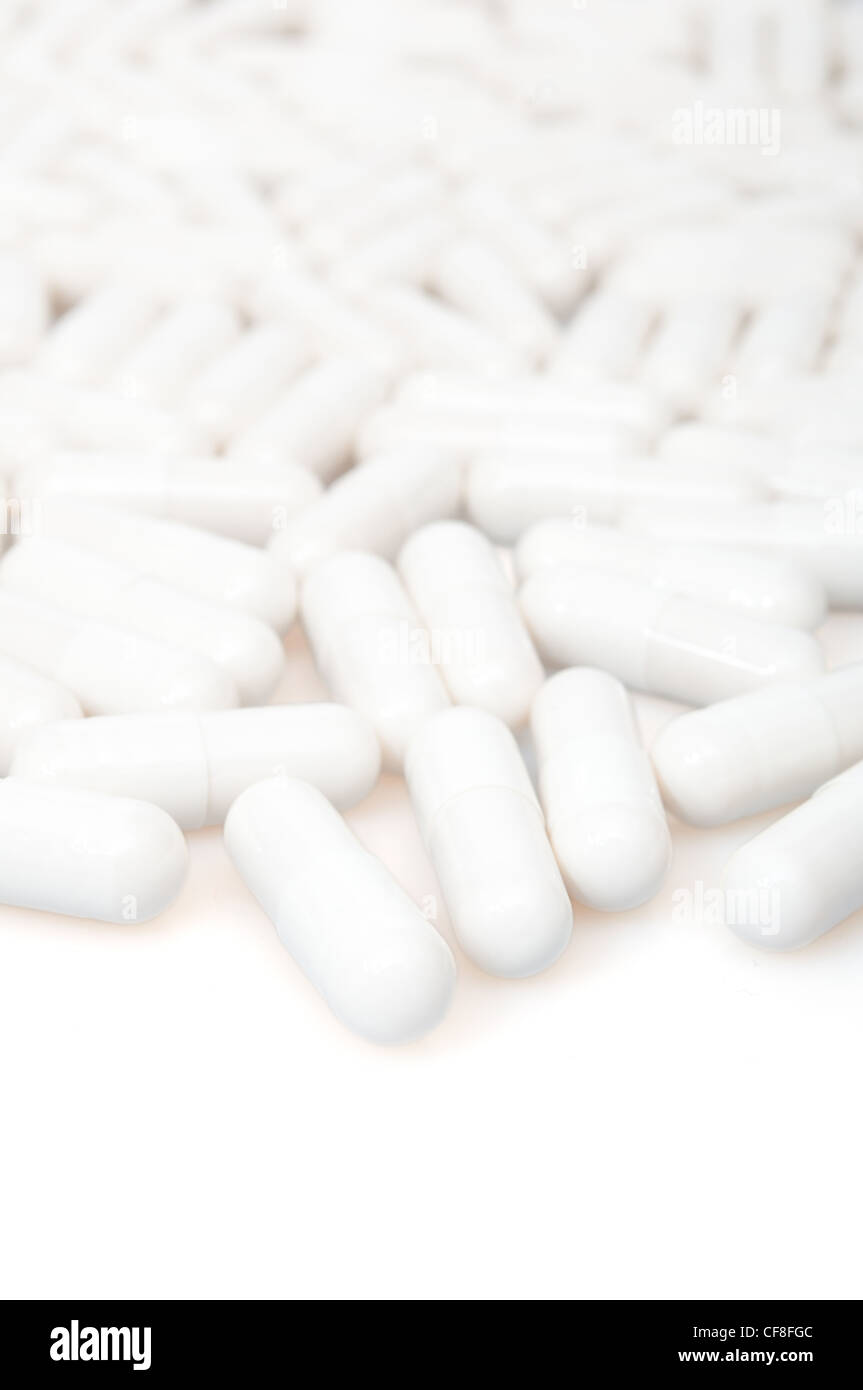 Medical White Capsule On White Background Stock Photo - Alamy