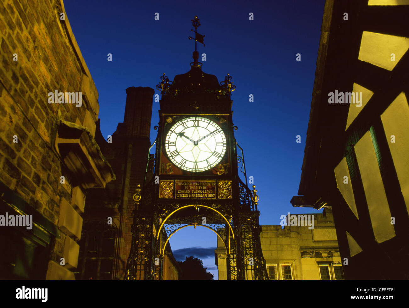 Eastgate Victorian Clock and half-timbered buildings at night Chester ...