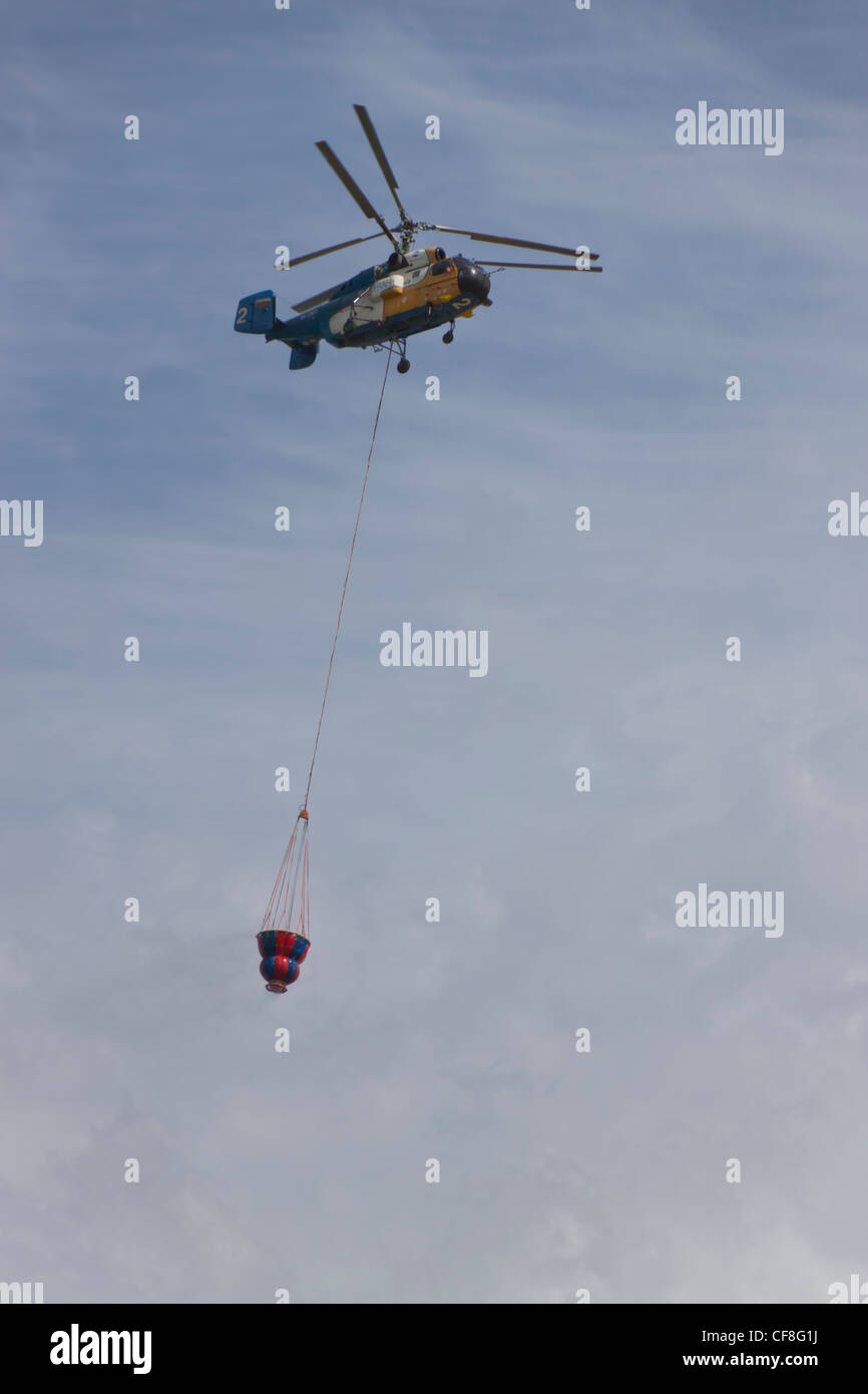 Fire fighting helicopter in flight Stock Photo - Alamy