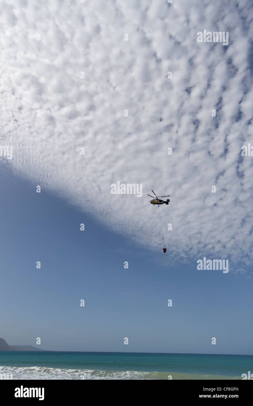 Fire fighting helicopter over the sea near Polis, Paphos area, Cyprus ...