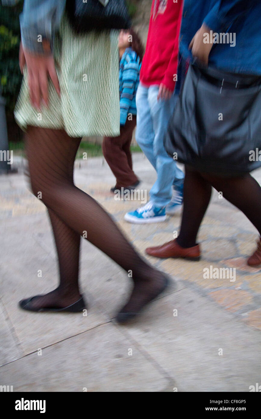 pedestrians women legs walking in street Stock Photo - Alamy