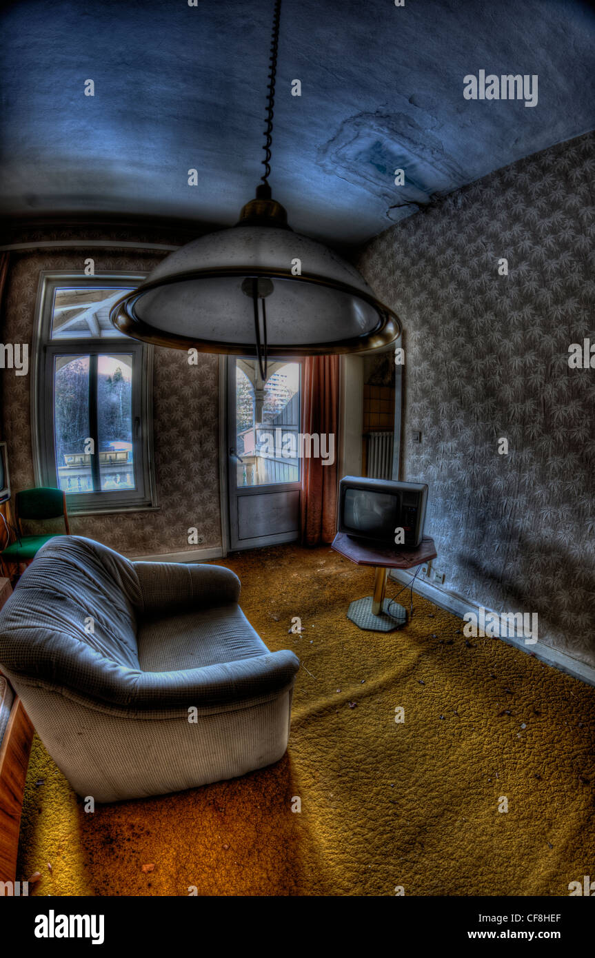 Interior of disused hotel near East German border with grey interior ...