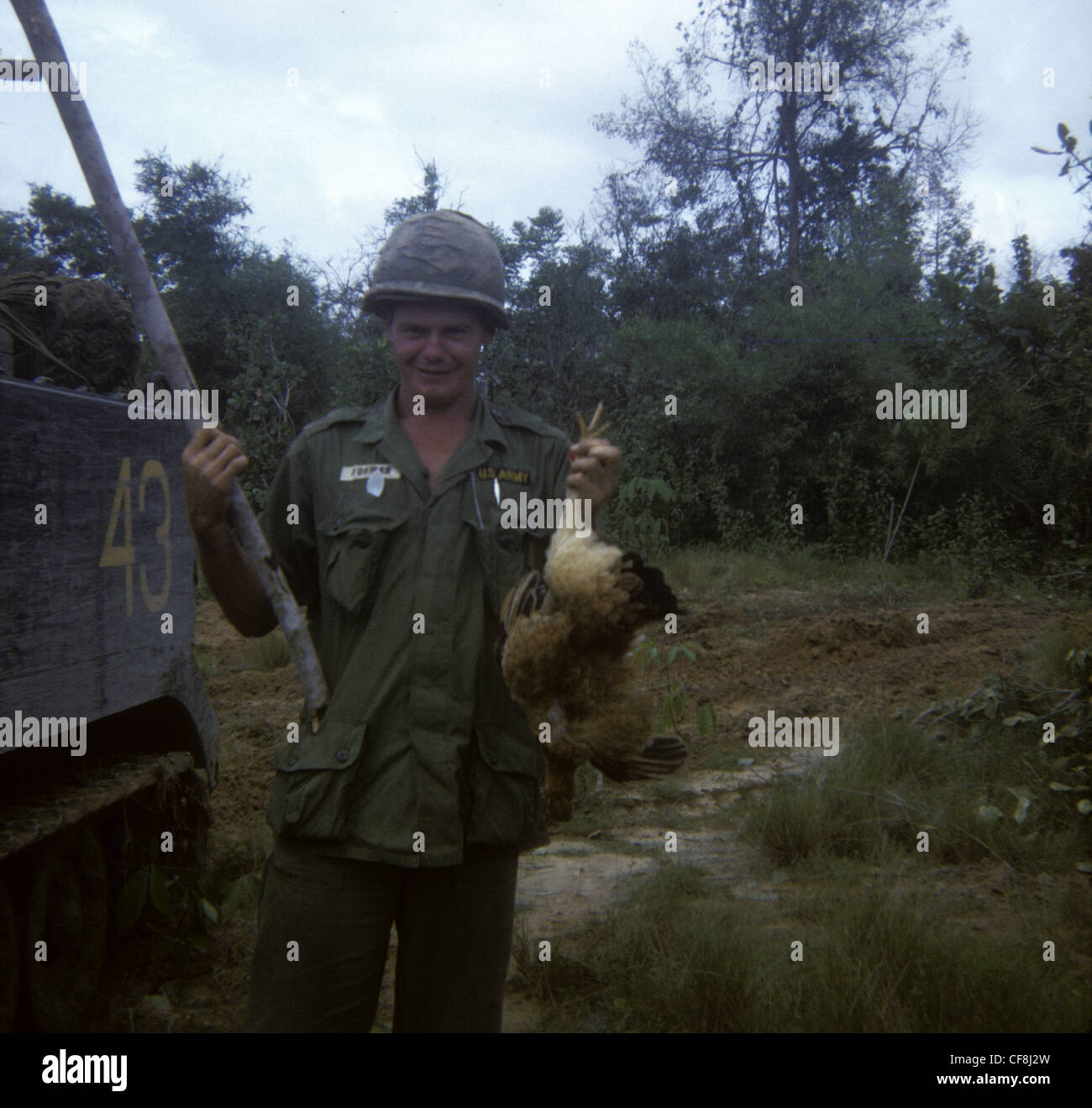 American soldier holding captured VC chicken 1/5th (Mechanized ...