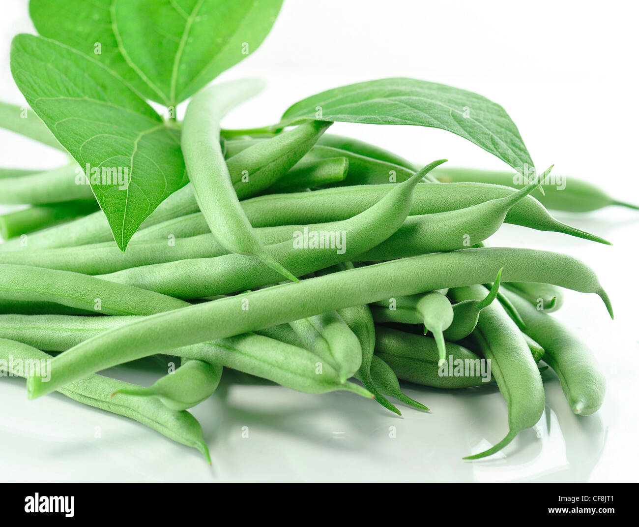 fresh green beans on white background Stock Photo - Alamy