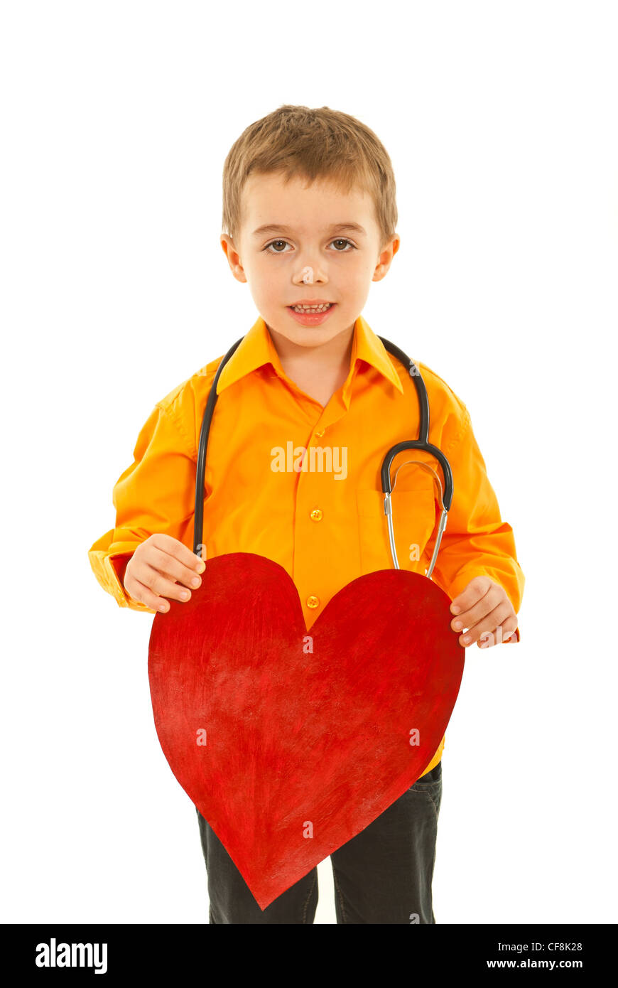 Future doctor boy holding heart shape isolated on white background ...