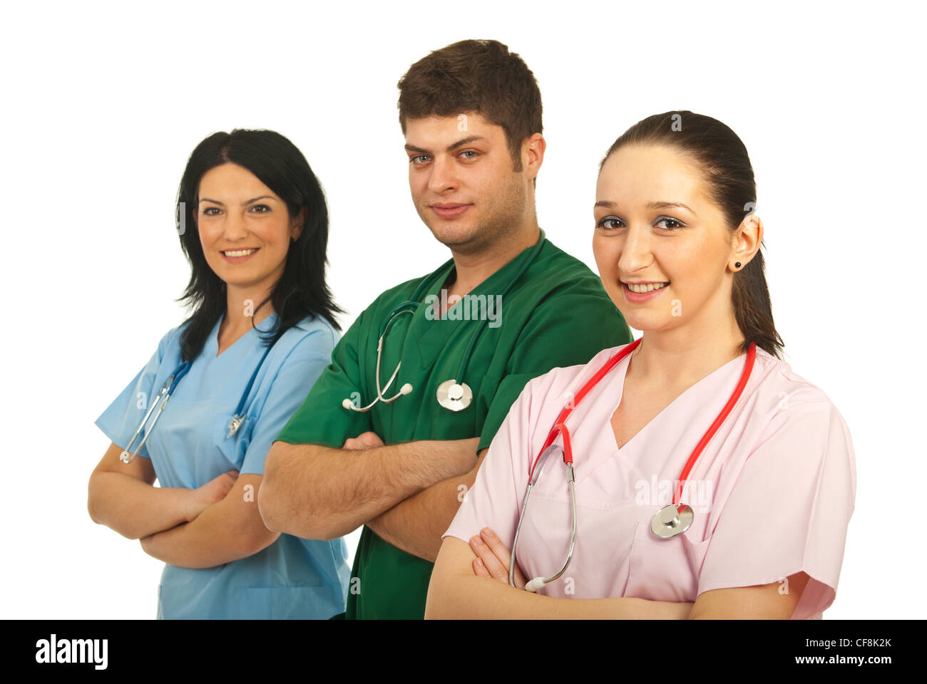 Happy three hospital workers standing in a line with arms folded ...