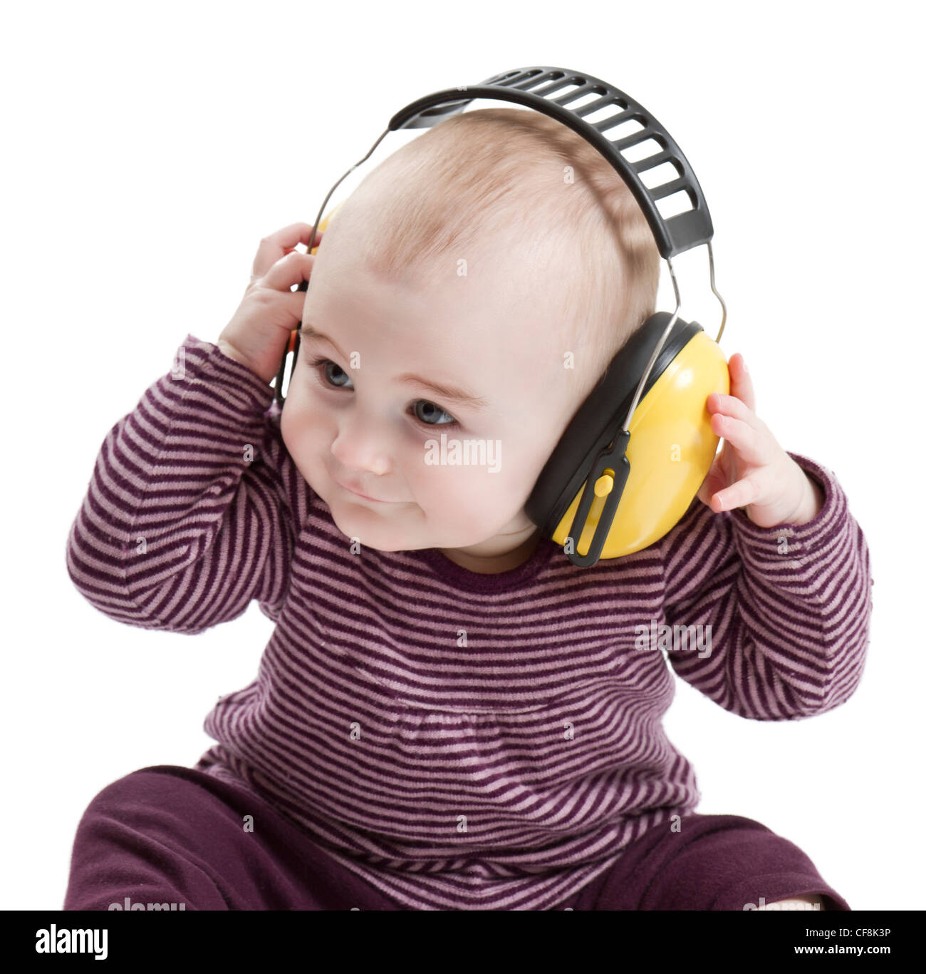 baby with yellow ear protection in loud environment. white background ...