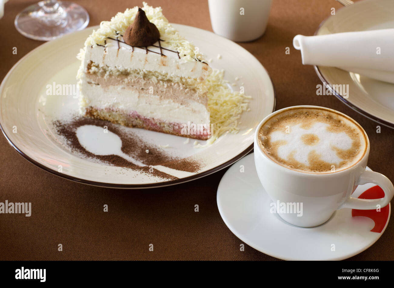 tasty cake at plate closeup with coffee cup Stock Photo - Alamy