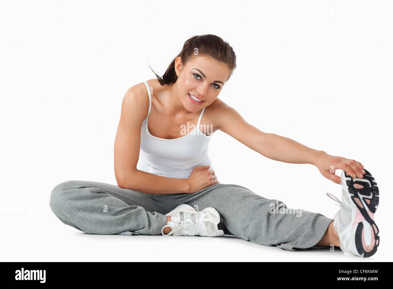 Young woman warming up before workout Stock Photo - Alamy