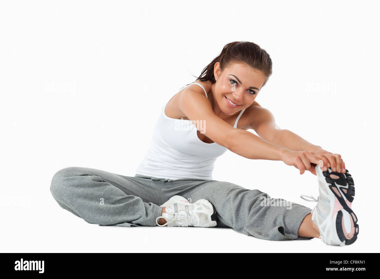Young female warming up before workout Stock Photo - Alamy