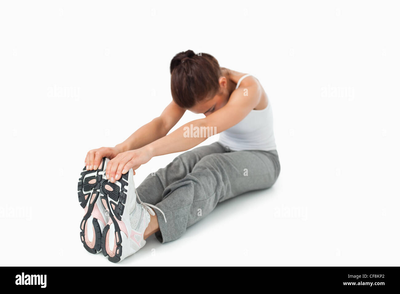 Young woman stretching before workout Stock Photo - Alamy