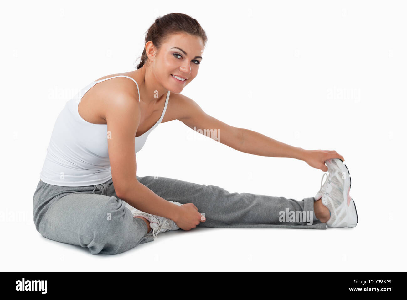 Side view of stretching woman Stock Photo - Alamy