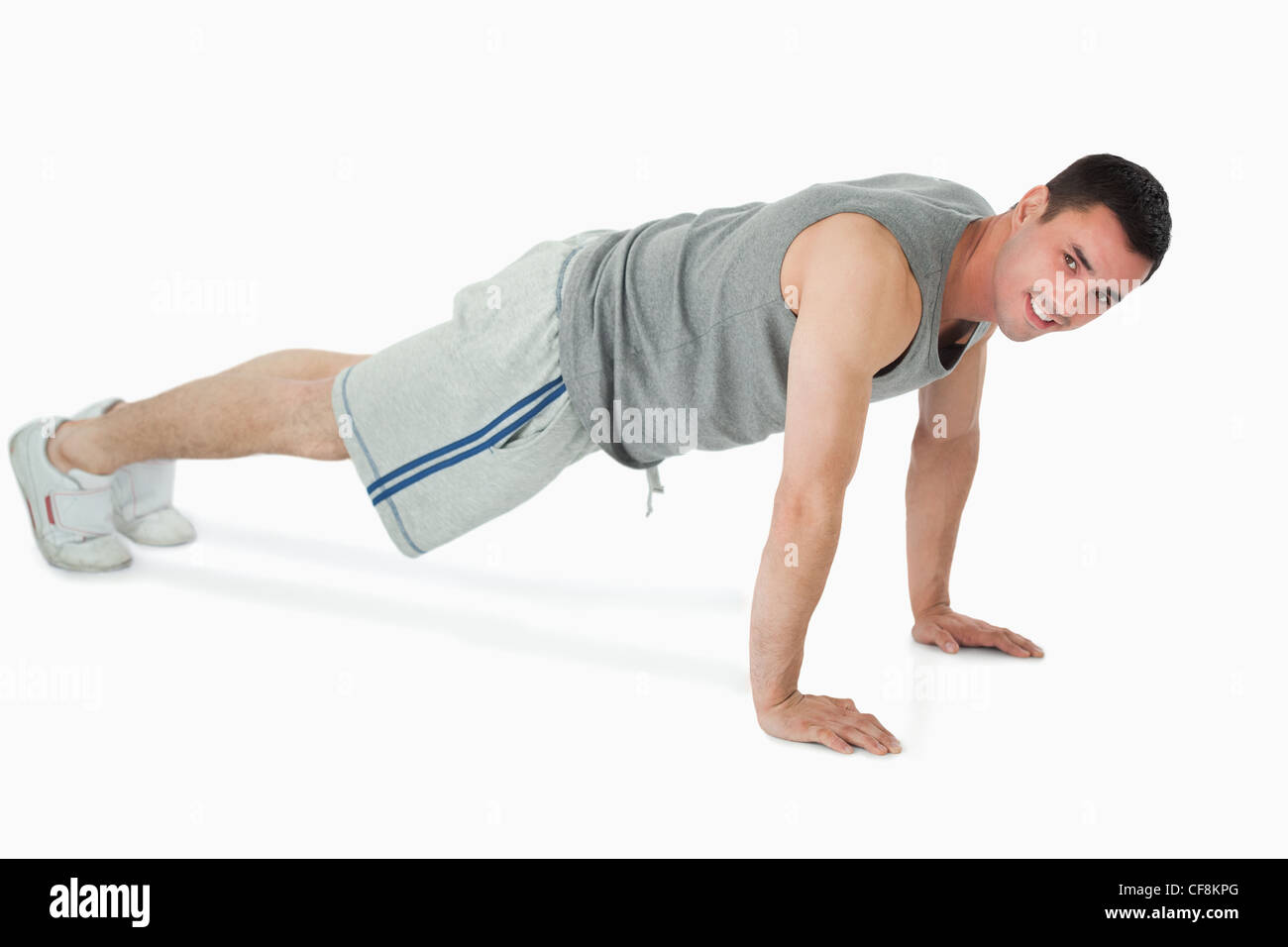 Side view of man doing push ups Stock Photo - Alamy