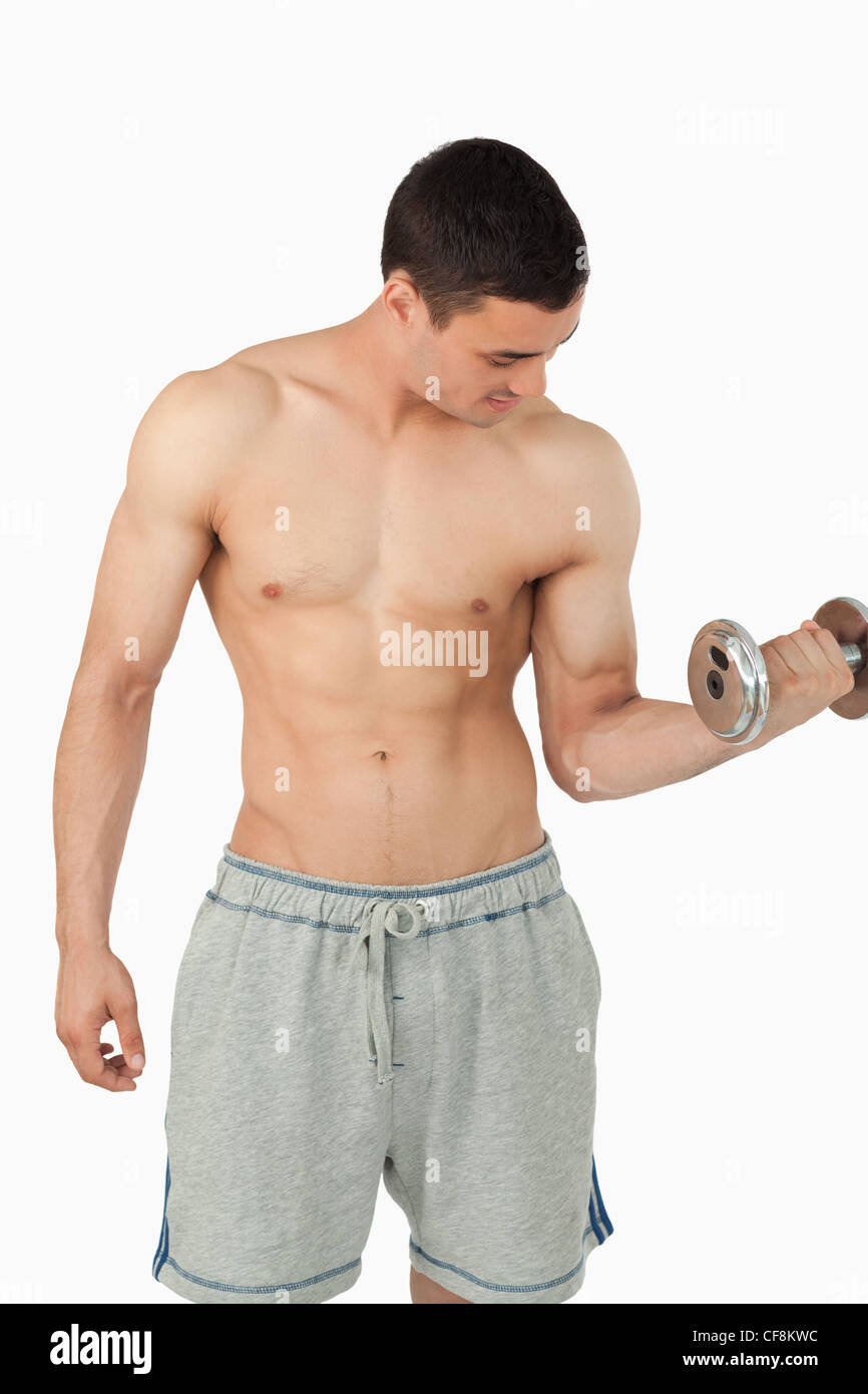 Atletic male lifting weights Stock Photo - Alamy
