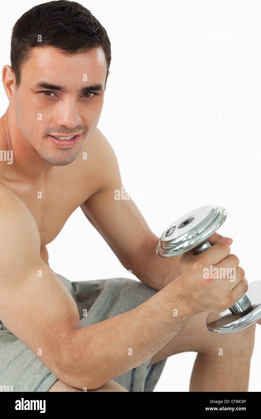 Athletic man pumping biceps dumbbell hi-res stock photography and ...