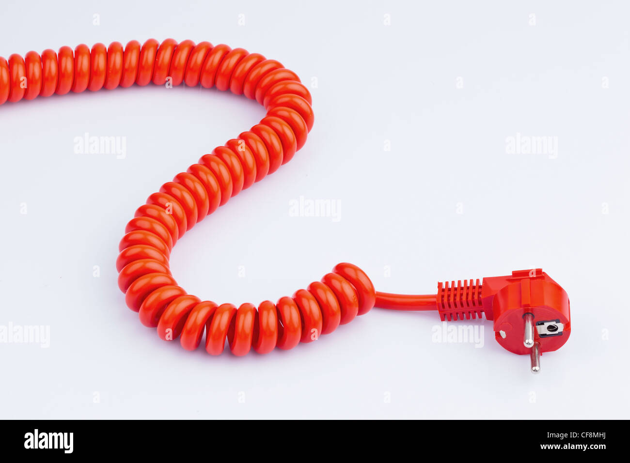 a red power cable with a connector located on a white background Stock ...