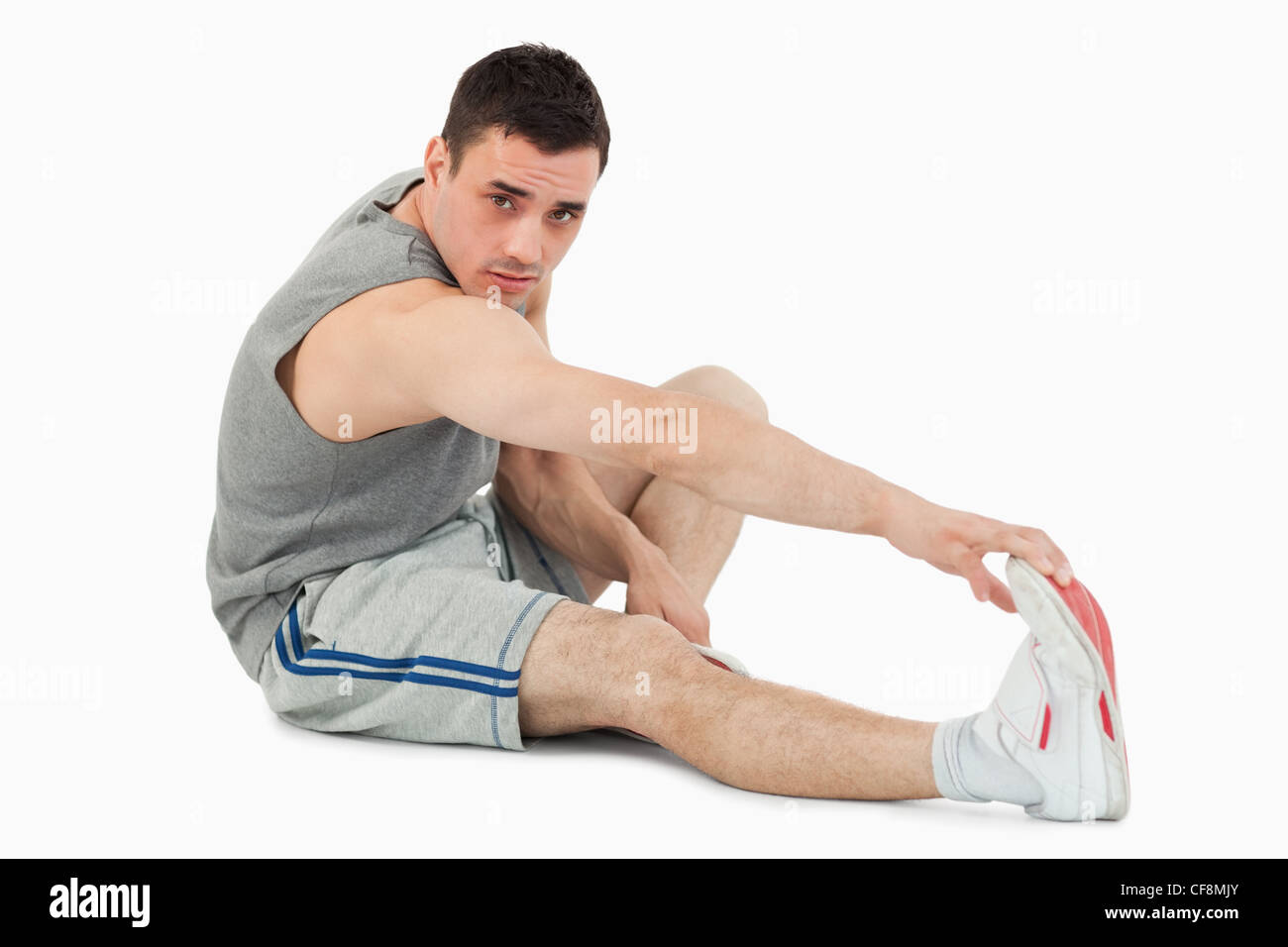 Male bodybuilder stretching gym Cut Out Stock Images & Pictures - Alamy