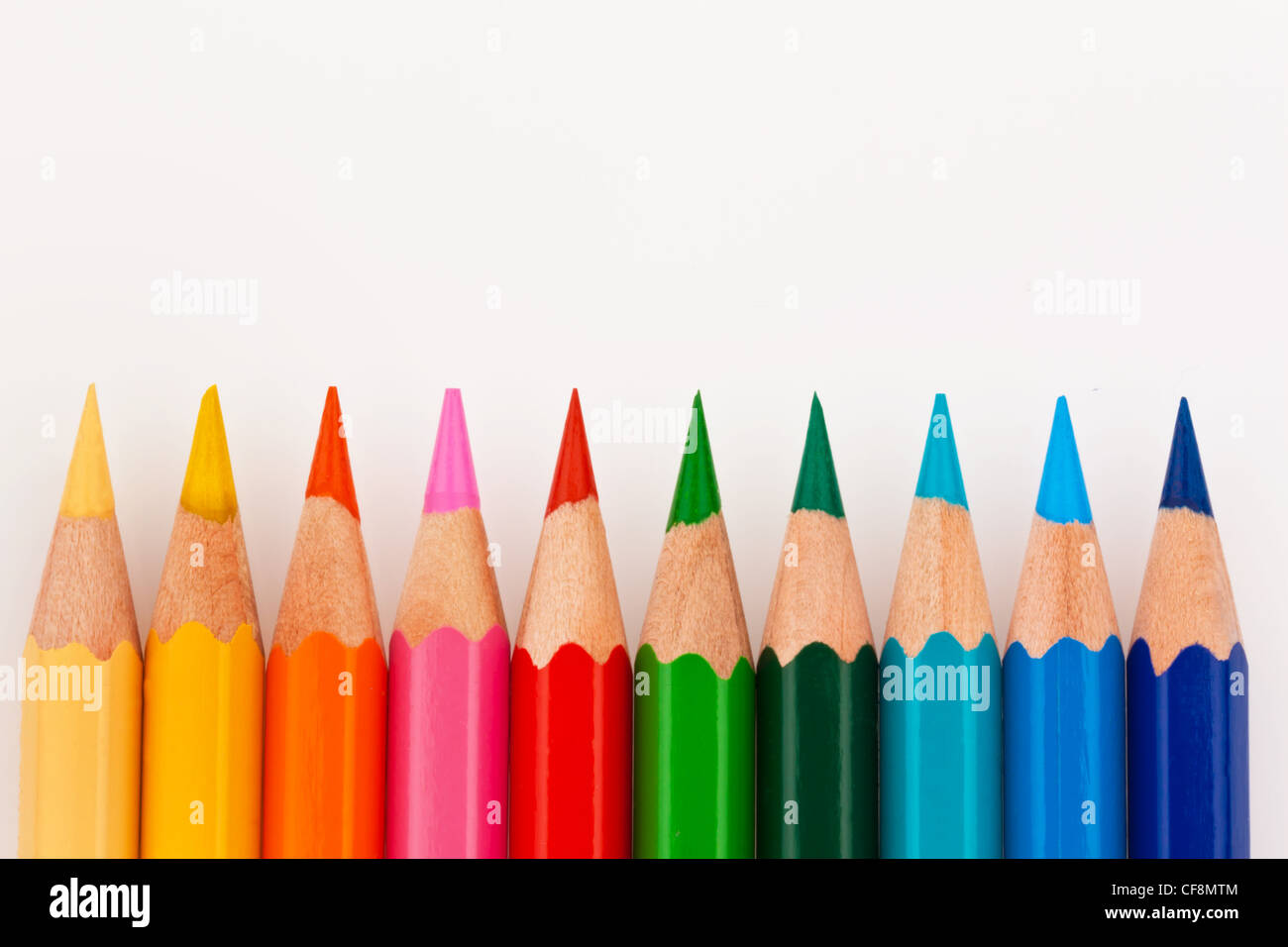 many different colored crayons on a white background Stock Photo - Alamy
