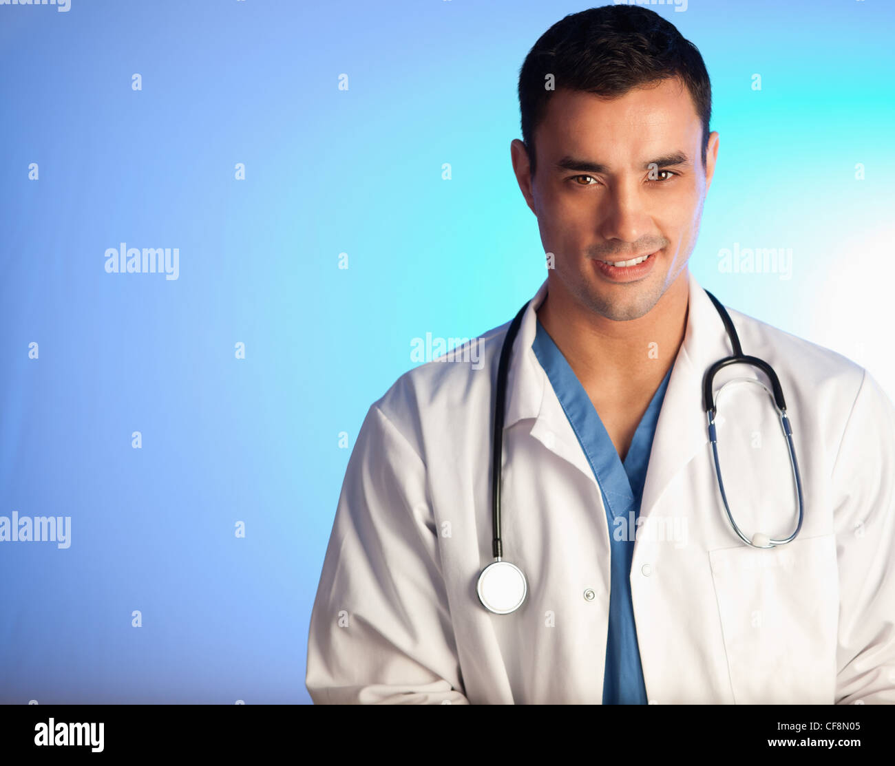 Handsome doctor posing Stock Photo - Alamy
