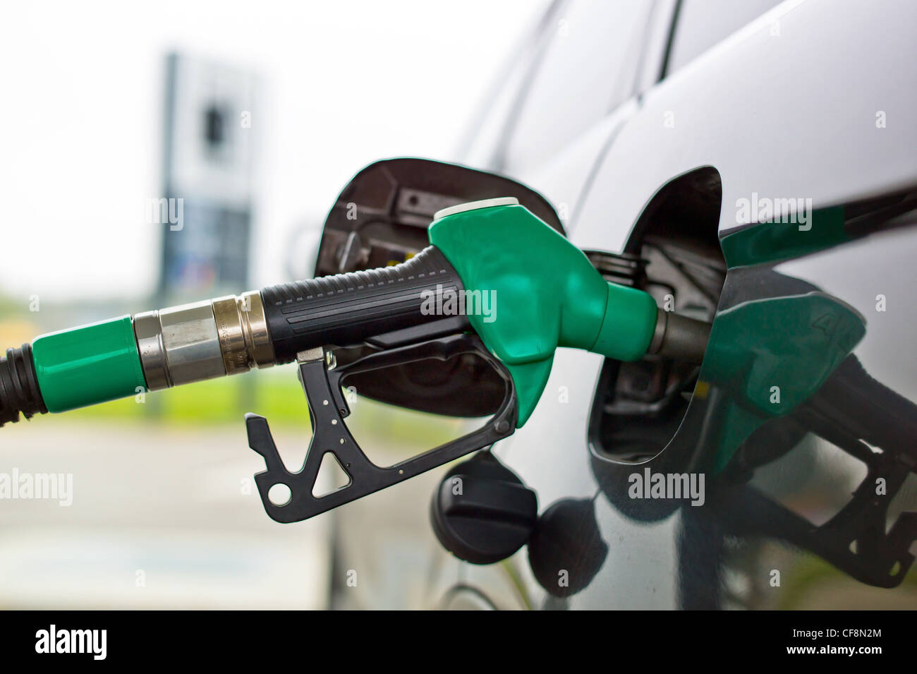 a tap for gasoline at a gas station. refueling a car Stock Photo - Alamy