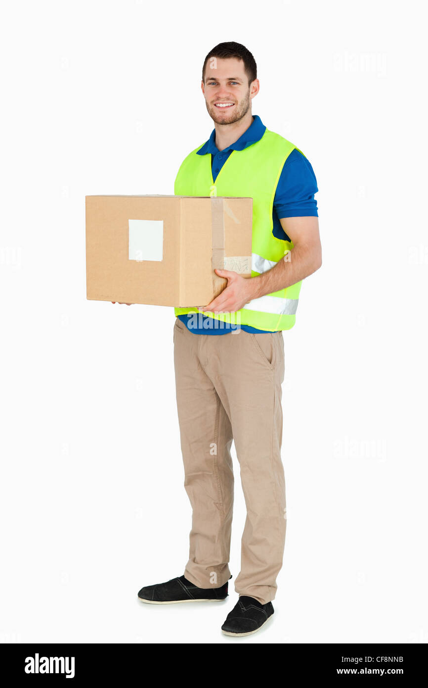 Young delivery man holding hi-res stock photography and images - Alamy