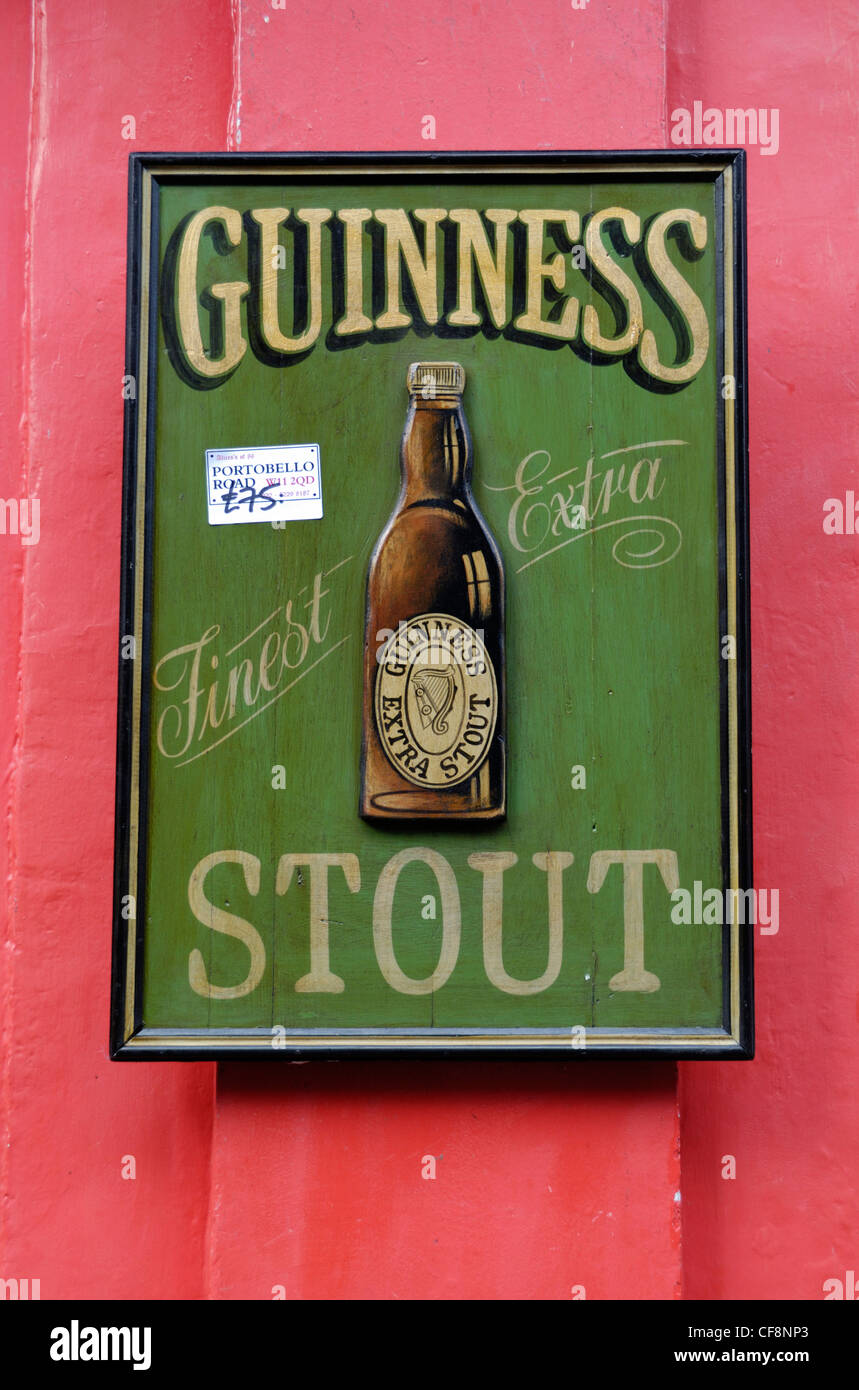 Antique ‘ Guinness Stout ‘ sign Stock Photo - Alamy