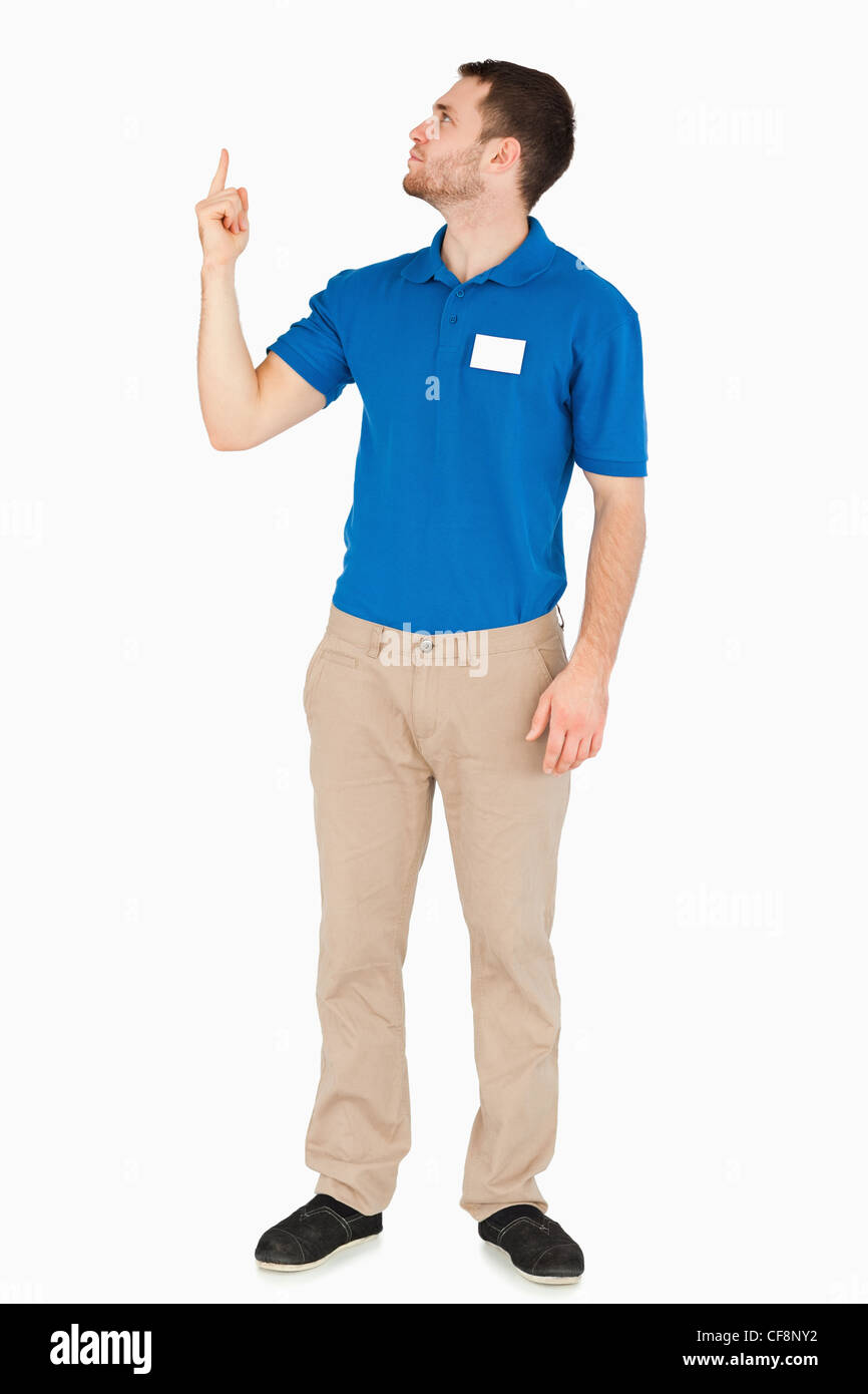 Young salesman looking and pointing upwards Stock Photo - Alamy