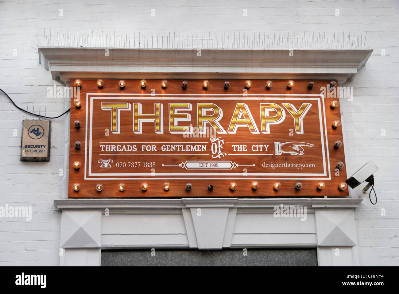 ' Therapy ' sign outside a men's clothing shop Stock Photo - Alamy