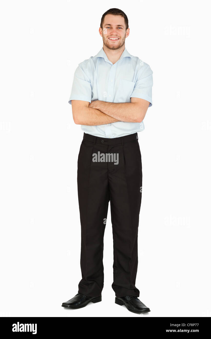 Smiling young post employee with arms folded Stock Photo - Alamy