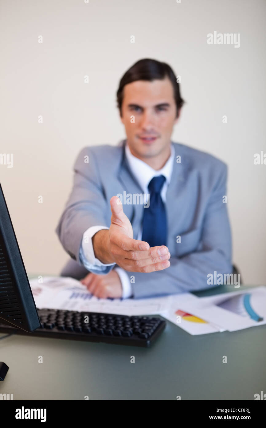 Hand being offered by businessman Stock Photo - Alamy