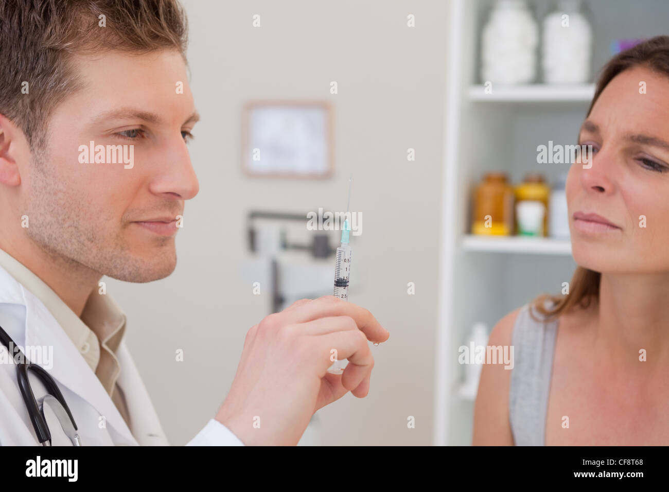 Doctor with syringe Stock Photo - Alamy