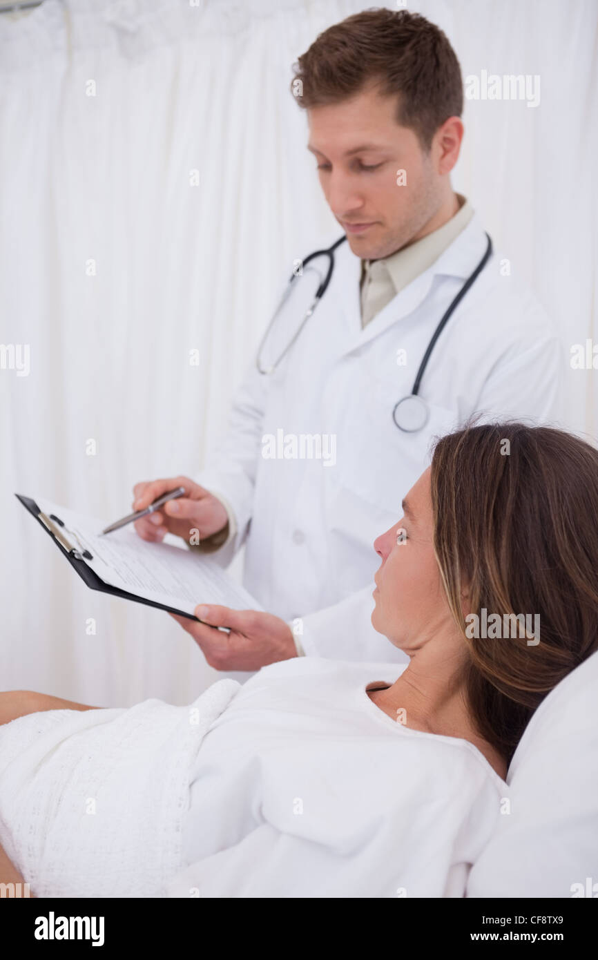 Doctor explaining his patient the examination results Stock Photo - Alamy