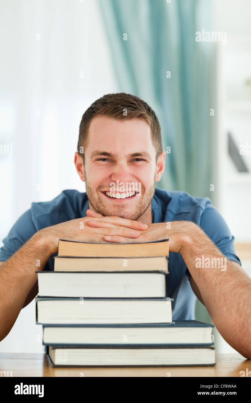 Smiling student with his books Stock Photo - Alamy