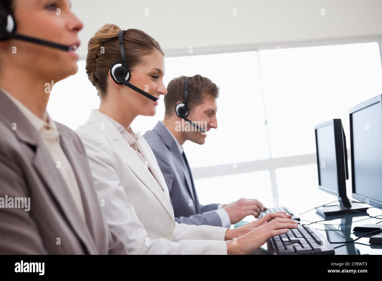 Side view of customer service department Stock Photo - Alamy