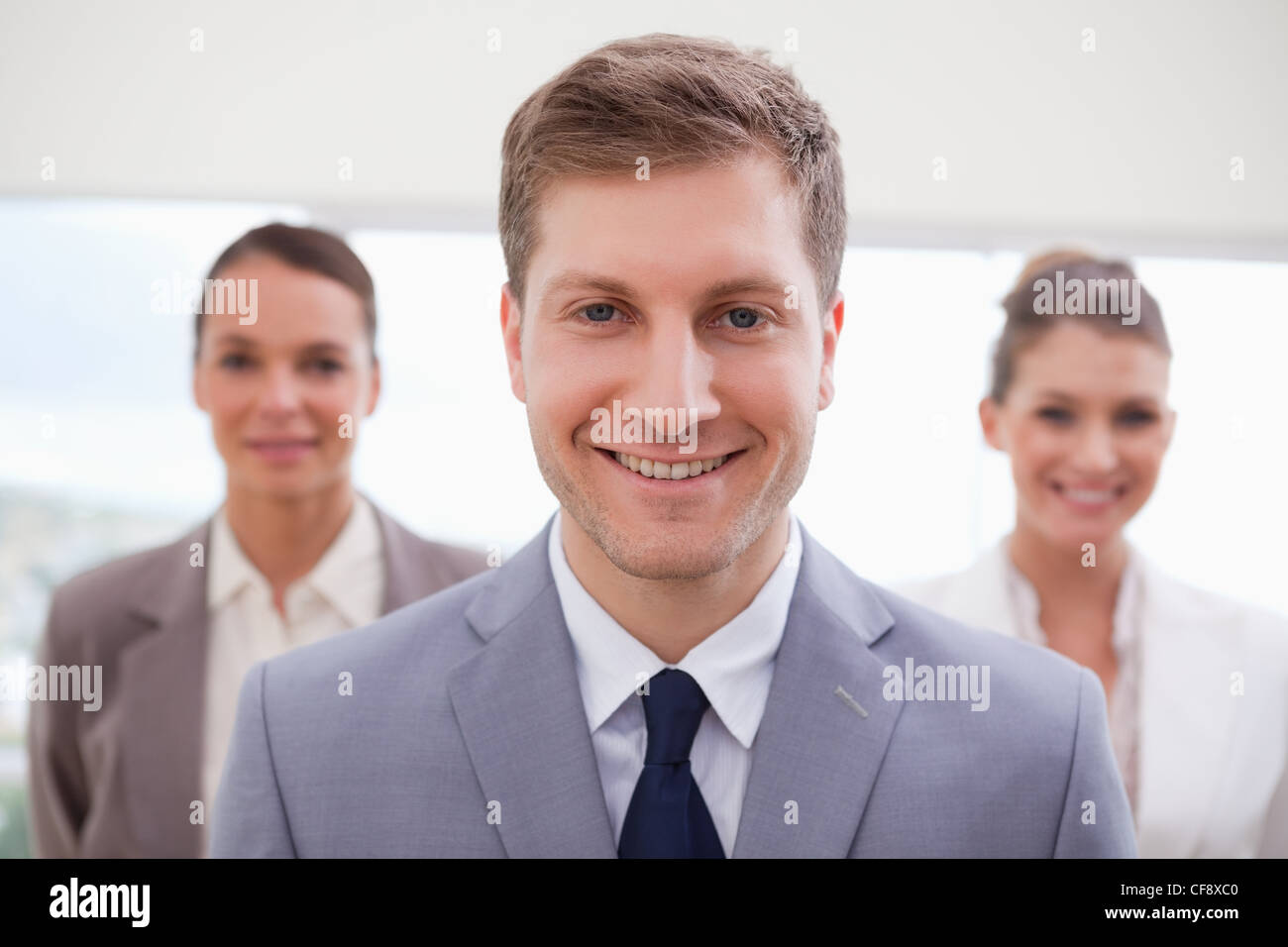 Sales manager standing Stock Photo - Alamy