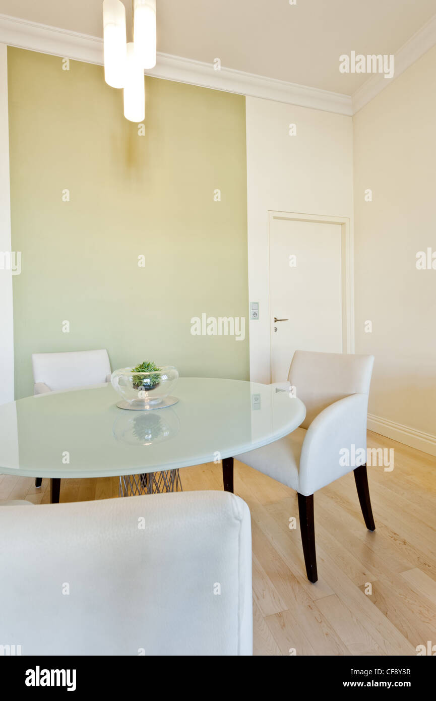 Contemporary table and seating area with a closed door in the ...
