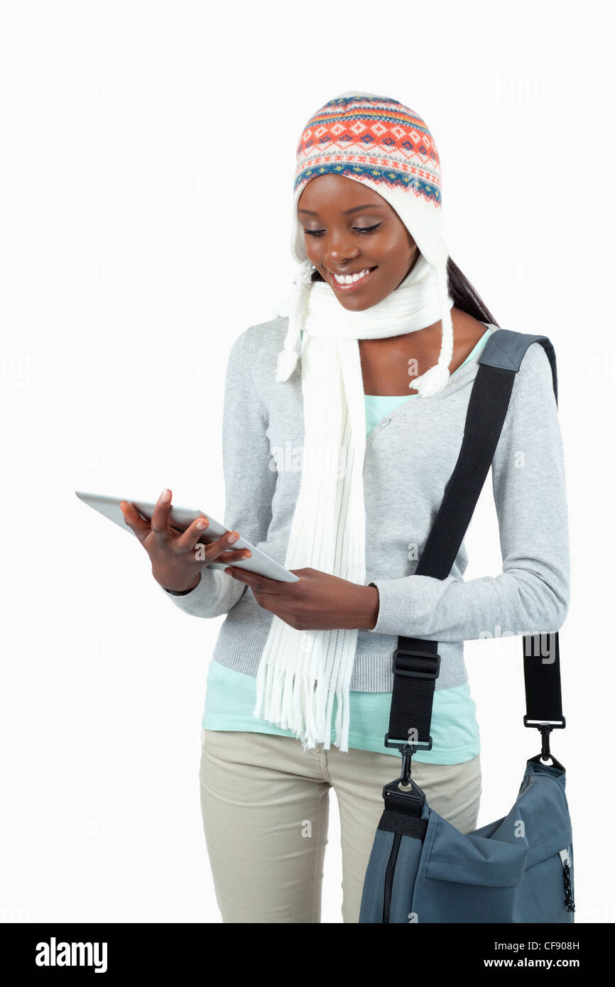 Smiling student in winter clothes with her tablet Stock Photo - Alamy